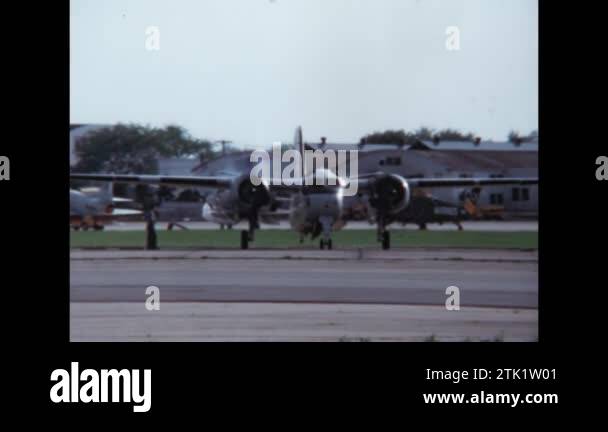 Vintage naval aviation airplane parked warming up piston radial engines ...