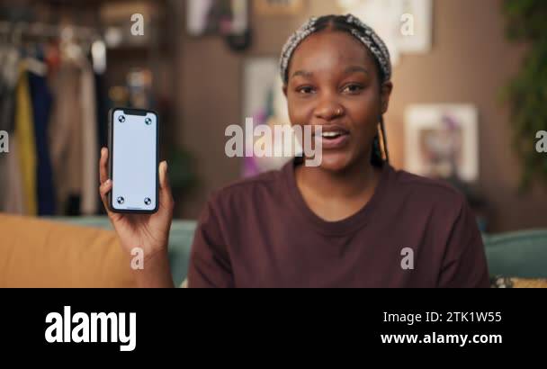African woman embraces role as a tech reviewer, recording a detailed ...