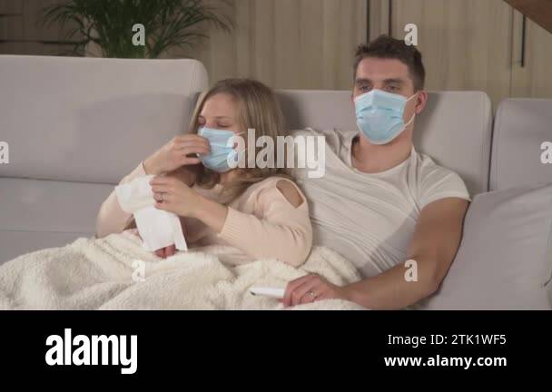 CLOSE UP: Lovely couple resting on comfy sofa and getting over a ...
