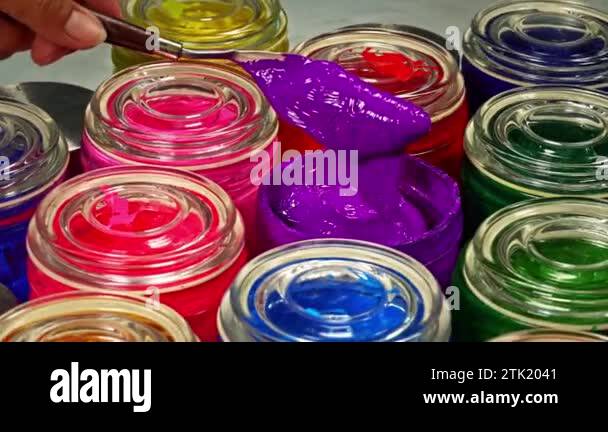 Use a trowel to stir the purple mass in a rotating flask.Stirring the ...