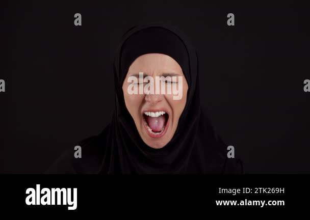 Emotional breakdown. Close up portrait of young angry muslim woman in ...