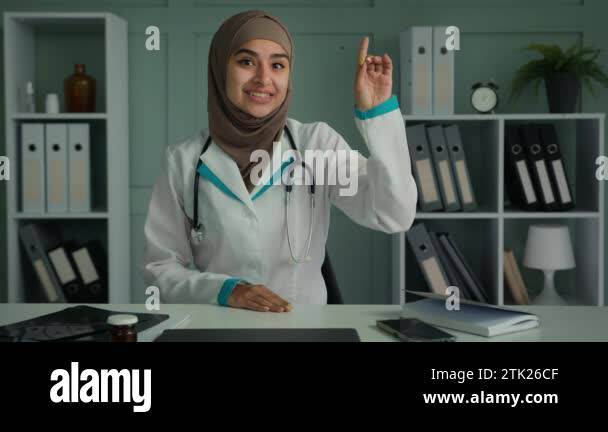 Webcam view arabian woman in hijab young general practitioner female doctor talking distant ...