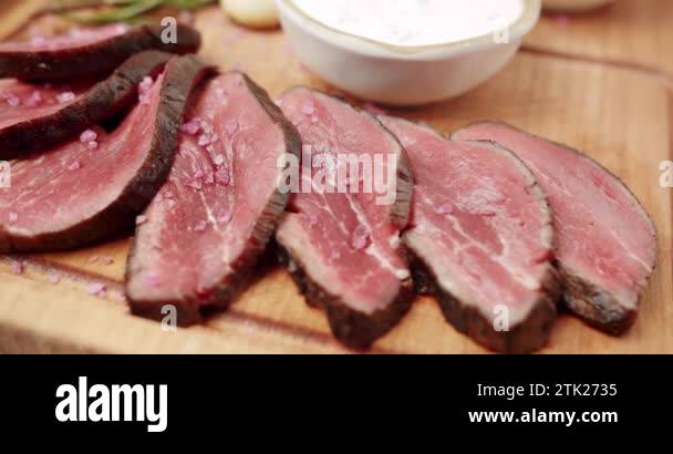 Sliced Beef Meat. Rare medium cooked beef with garlic and rosemary ...