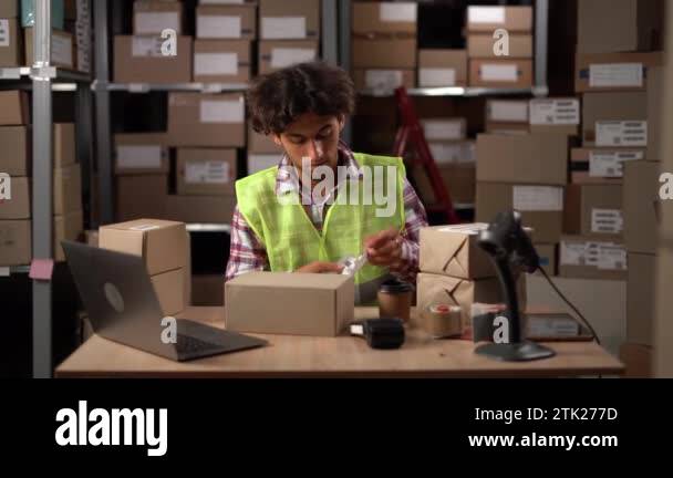 Scanning barcode on delivery parcel. Worker putting labels and scan ...