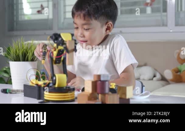 Child learning repairing getting lesson control robot arm, Happy Asian ...