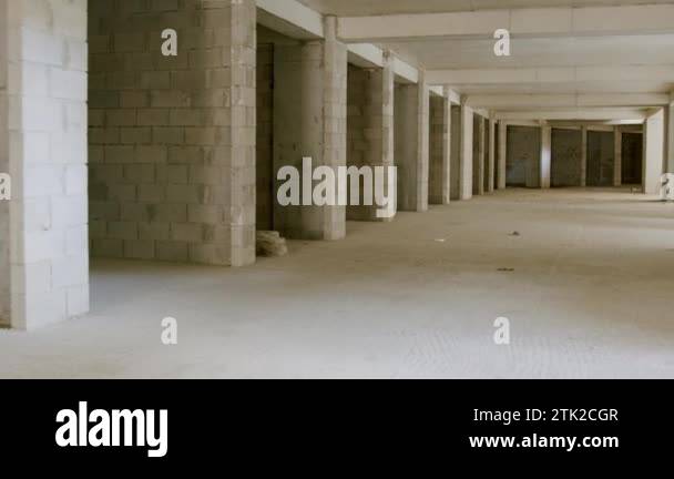Corridor under construction of a modern white brick shopping center ...