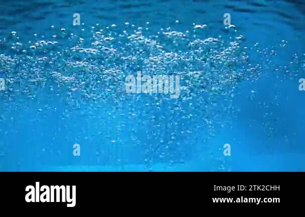 Underwater View Of Stream Of Air Bubbles Rising Onto The Surface Of