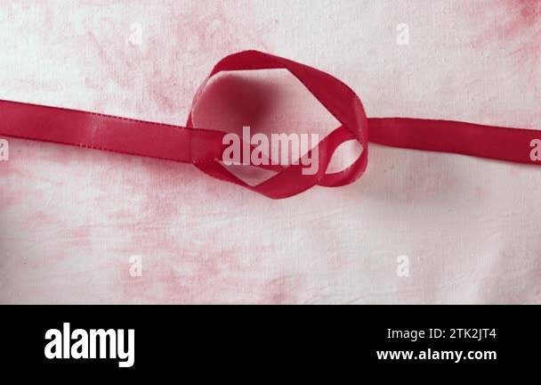 Red ribbon knot Stock Videos & Footage - HD and 4K Video Clips - Alamy