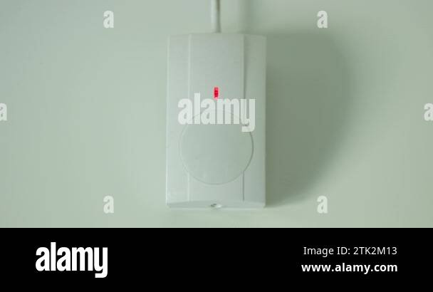 The motion sensor alarm is triggered. The red LED on the sensor lights ...