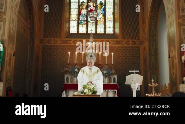 Funeral, church and pastor with prayer by coffin for memorial service ...