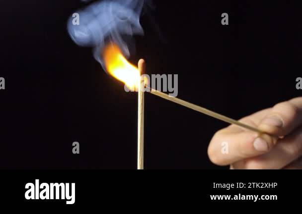 Igniting Match and Flame on a Black Background. Slow Motion. Close-up ...