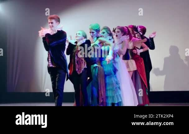 Modern theater artists singing standing on stage with actor appearing ...