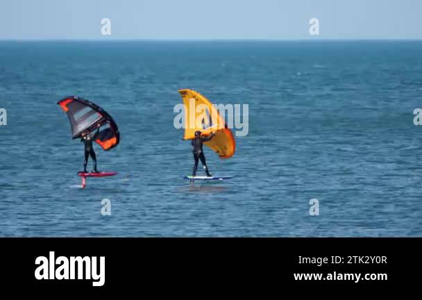 Chicago, IL - November 3rd 2022: Two people glide across the surface of ...