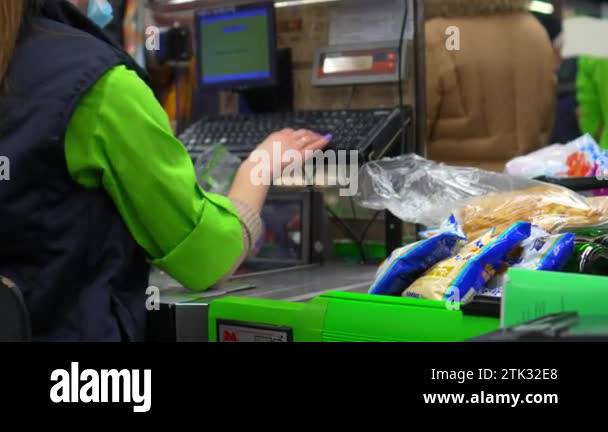 At Supermarket: Checkout Counter Professional Cashier Scans Groceries ...