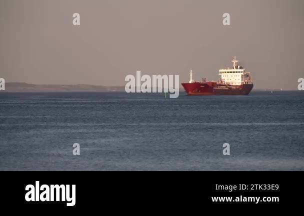 A containerized cargo ship enters the port for unloading. Big container ...