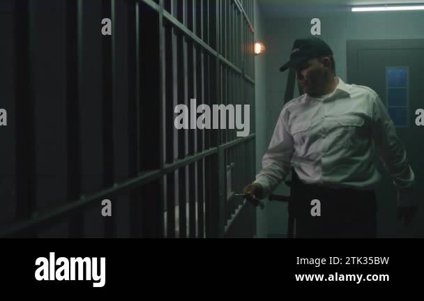 Jailer walks the corridor. Male prisoner hits prison employee, opens ...