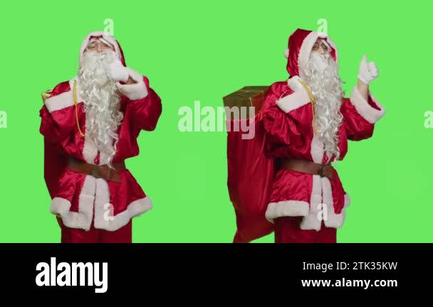 Father christmas shows thumbs up on camera, feeling positive giving ...