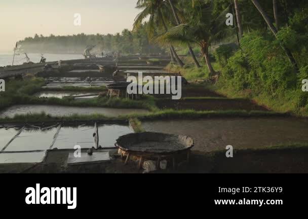 Traditional Salt Making Process on the beach sea shore Bali, Indonesia ...
