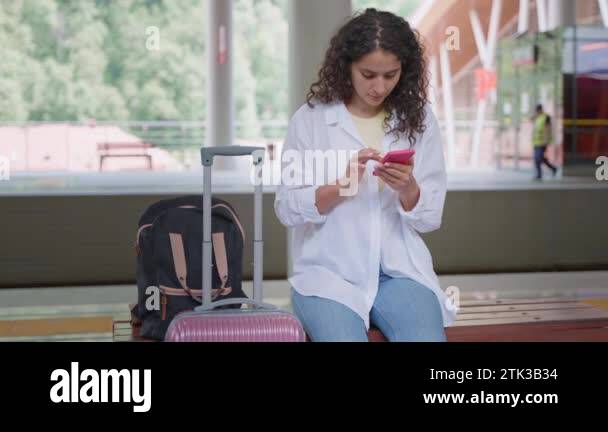 student girl waiting train on suburban platform of railway station ...