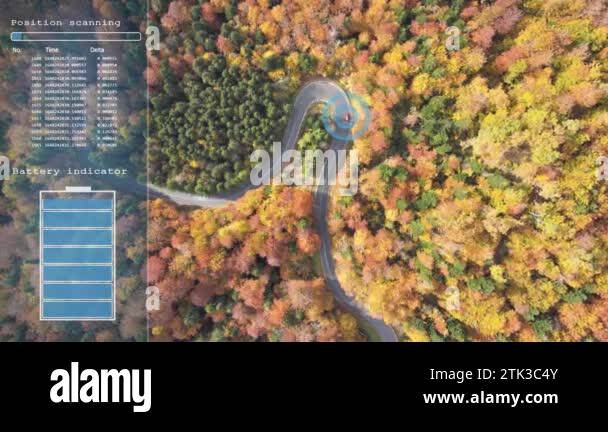 Autonomous electric car driving on a forest road with battery level and ...