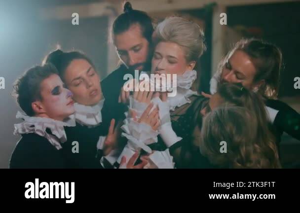 Beautiful leading actress in costume with neck ruff and closed eyes ...