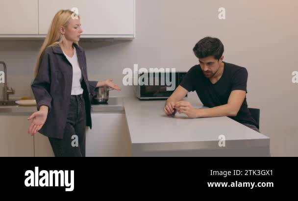 Family Quarrel in the Kitchen. Man and Woman Scream in Frustration and ...