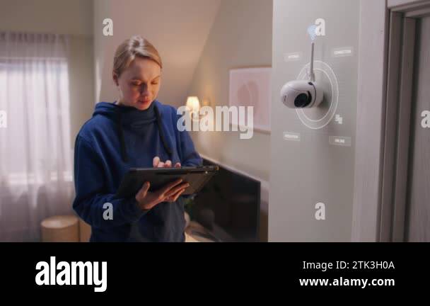 Woman sets up security camera with AI recognition system at home using ...