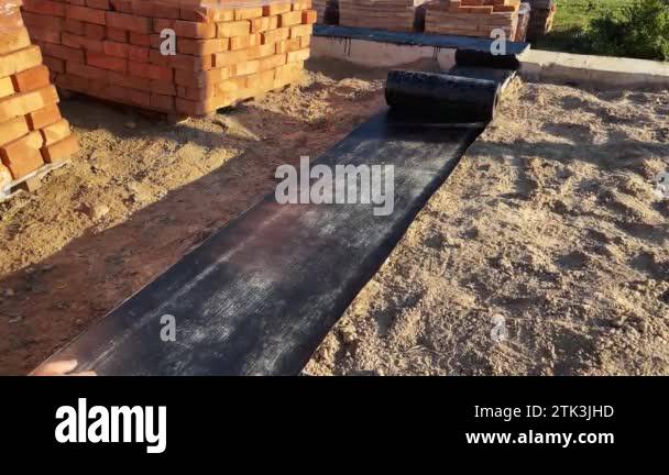 Roll waterproofing of the foundation of the building before the start ...