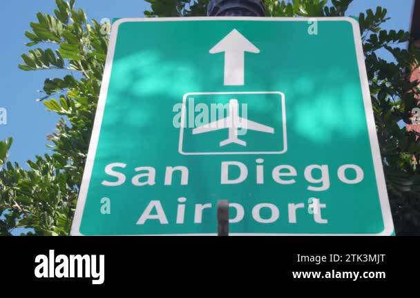 Airport green road sign with direction arrow and plane icon, San Diego ...