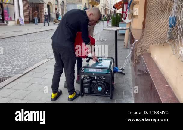 Lviv, Ukraine - Dec 29, 2022: A electricity generator work outside the ...