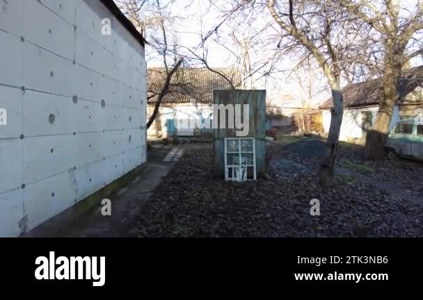 abandoned house in Ukraine. Rubbish in the yard. destroyed house ...
