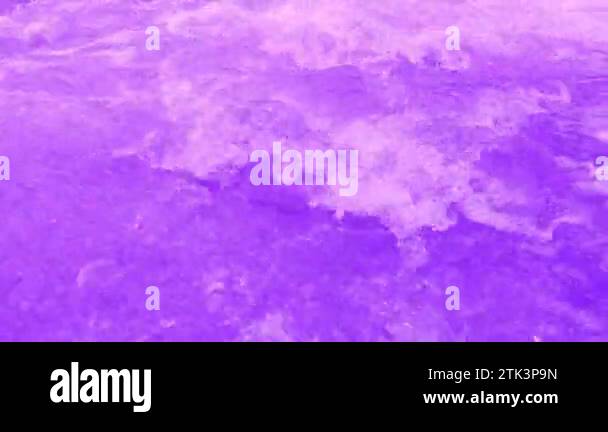 Defocus blurred transparent purple colored clear calm water surface ...