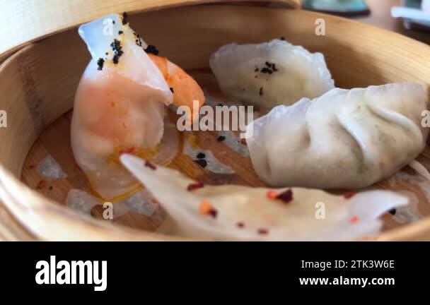 dim sam 4 types with different fillings Wooden boxes covered with a ...