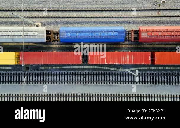 Cargo trains close-up. Aerial view of colorful freight trains on the ...