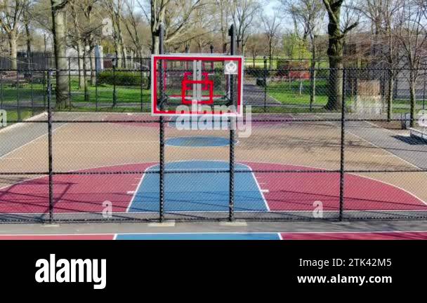 This video shows views of an empty basketball court with rims removed ...
