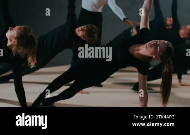 Side view group of theater actors and actresses in plank position ...
