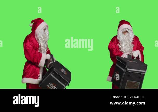 Deliveryman santa claus in character carrying thermal bag with fast ...
