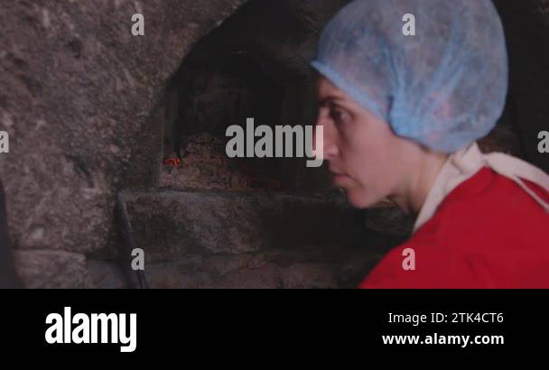 Woman Cook Fixing An Old-fashioned Oven At Chobareti Meskhetian House ...
