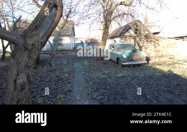 abandoned house in Ukraine. Rubbish in the yard. destroyed house ...