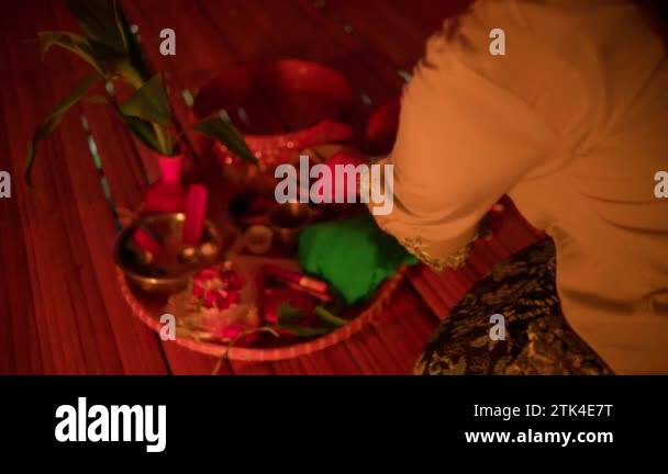 Indonesian women prepare the offerings for the god in the ritual form ...