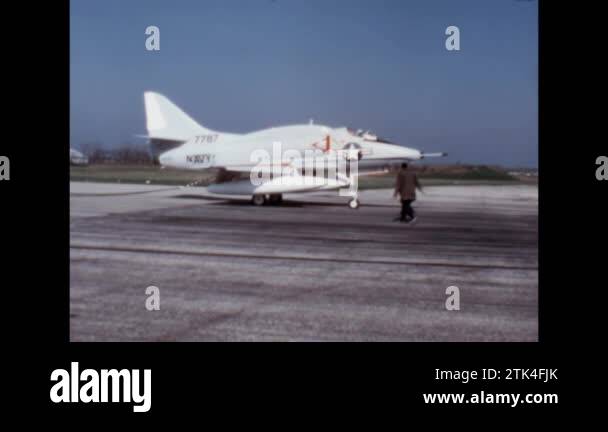 Jet fighter stationary on runway after landing still hooked to ...