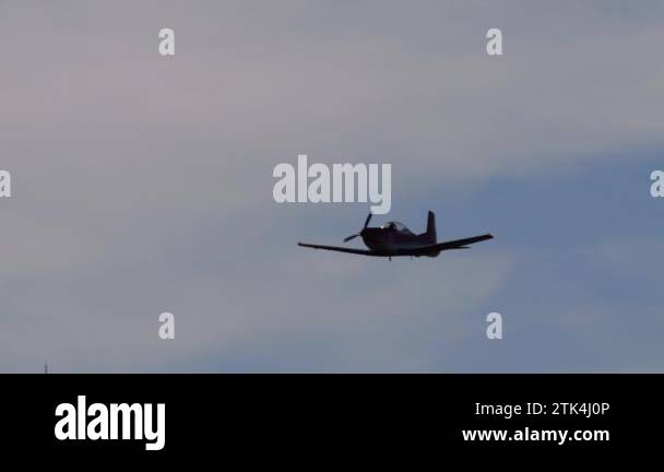 Military helicopter in flight at high speed in a narrow mountain valley ...
