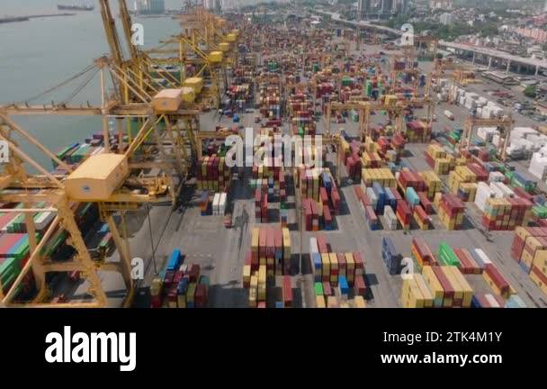 Forwards fly above large container terminal in seaport. Stocks of ...