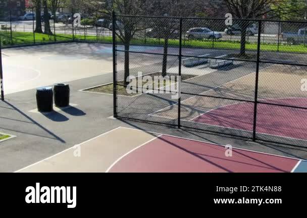 This video shows views of an empty basketball court with rims removed ...