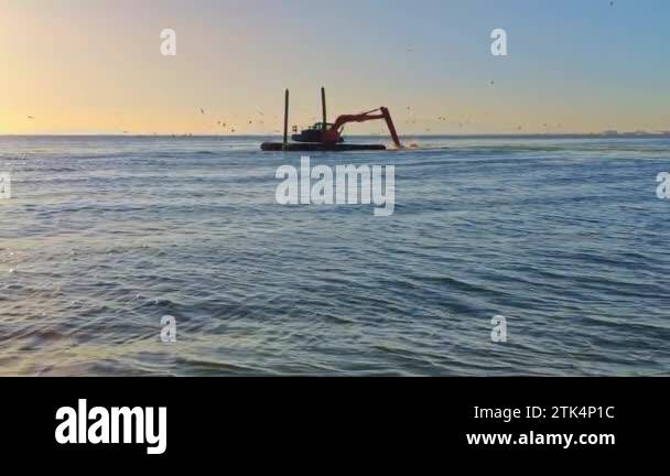 Excavator in the Middle of the Sea Cleaning the Plastic Garbage and ...