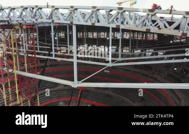 Roof arch beam carcass detail supported by scaffolds at stadium ...
