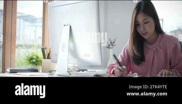 Asian male manager wearing black suit hand filling paper business ...