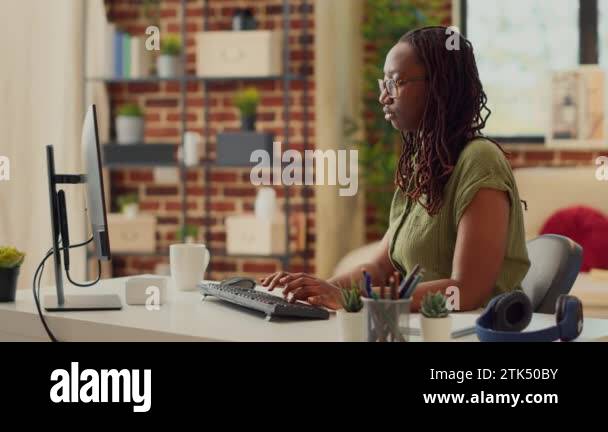 Office employee using computer to work on company report, sending email ...