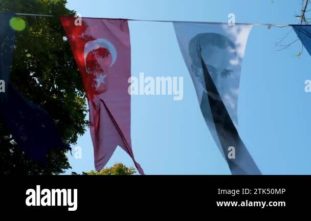 Turkey and Mustafa Kemal Ataturk flag with blue sky in the background ...
