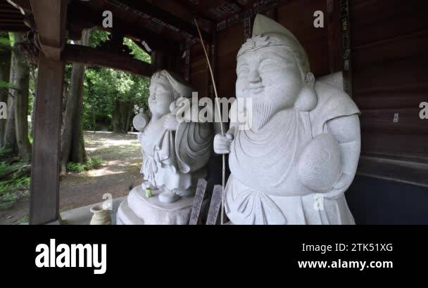 Japanese guardian statues at the traditional street in Tokyo. High ...